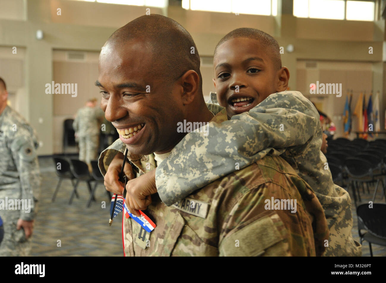 Georgia Army National Guard Capt. Chad Tyson receives a hug from son ...