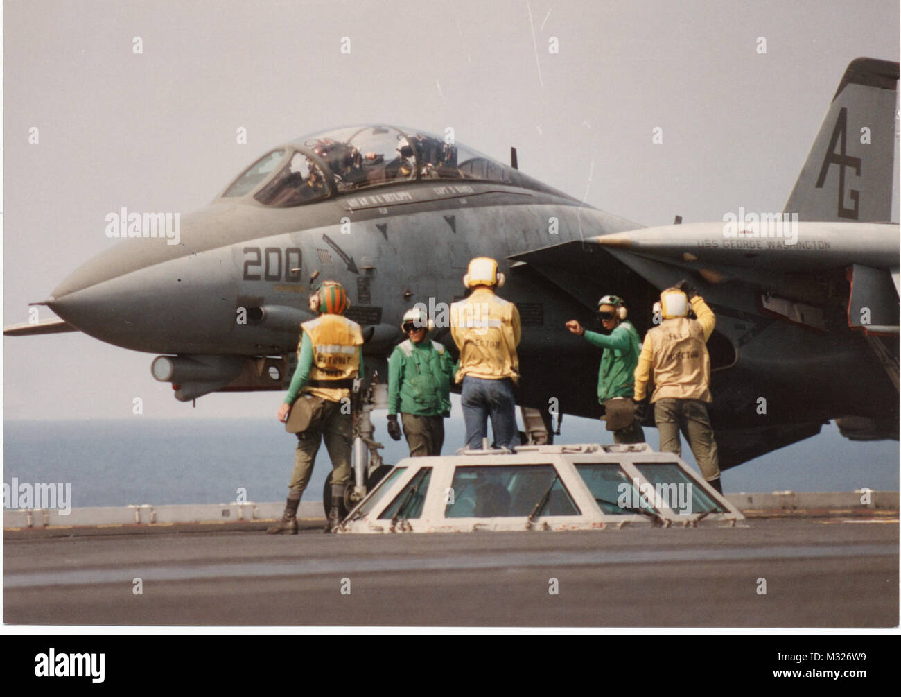 an F-14 on the flight deck of the uss george washington readies for the ...