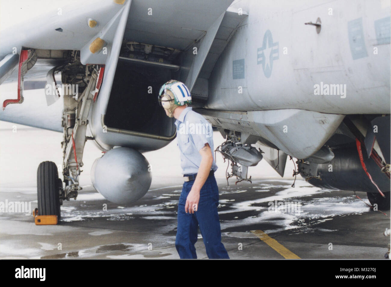 an air peers into the jaws of a tomcat with it's engine turning by ...