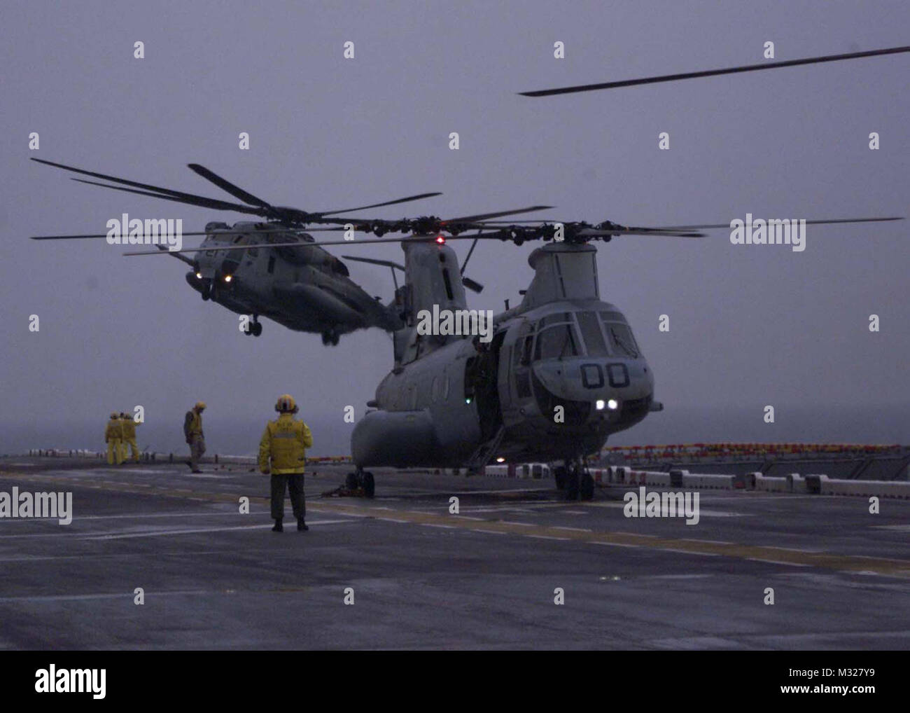 Helicopters from HMM-266 land aboard the USS Kearsrge, March 9, in ...