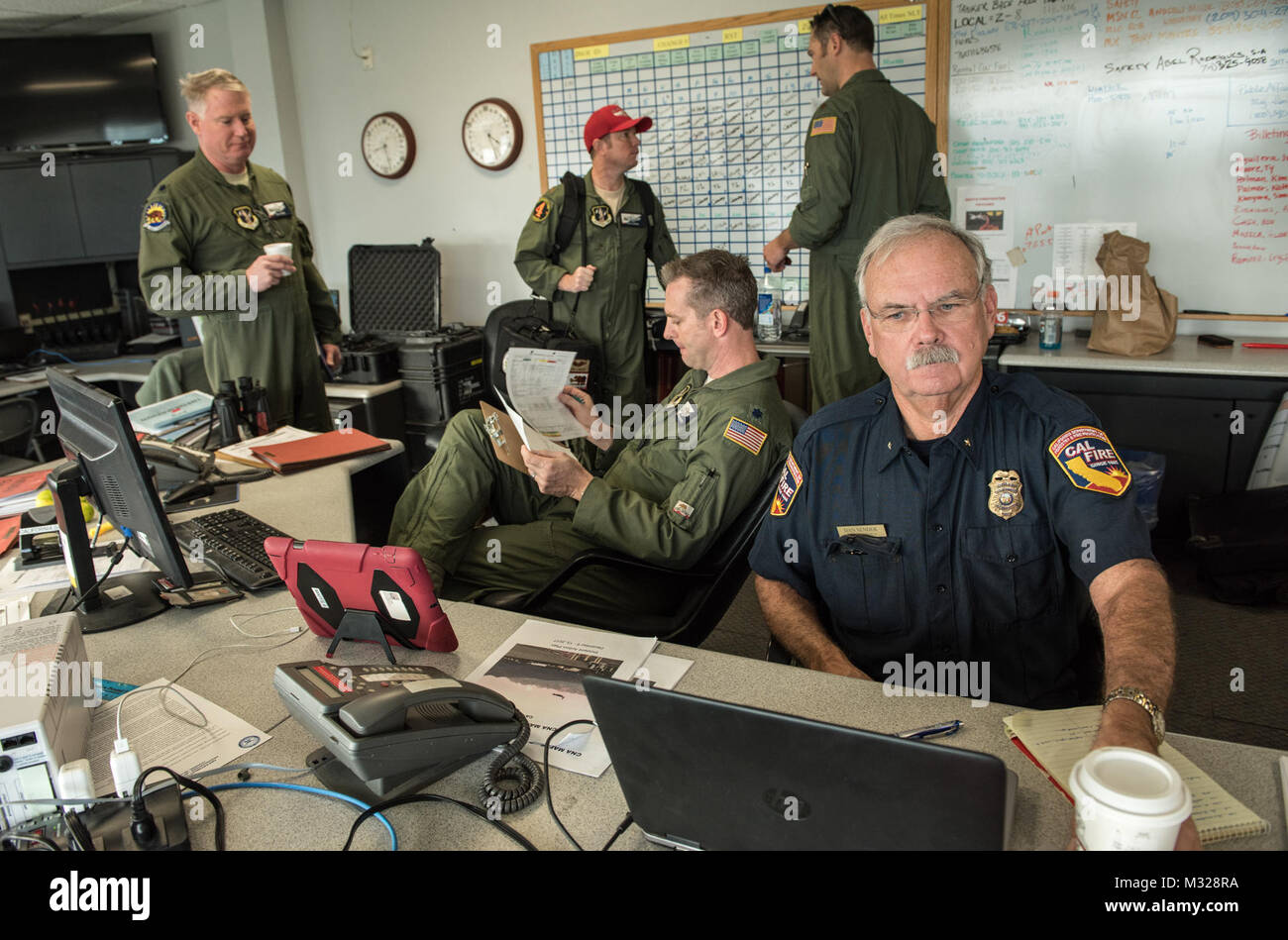 Cal Fire coordinators and the 146th Airlift Wing mission commander ...