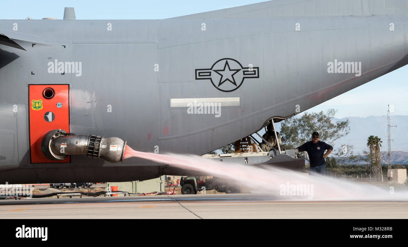 Technicians perform a test on a Modular Airborne Fire Fighting System ...