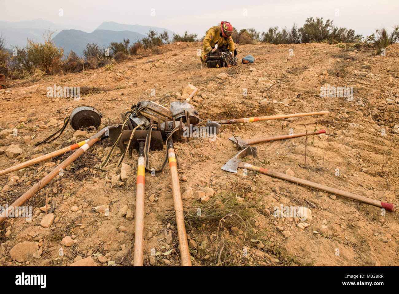 California Department of Corrections inmate fire fighter tools sit in a ...
