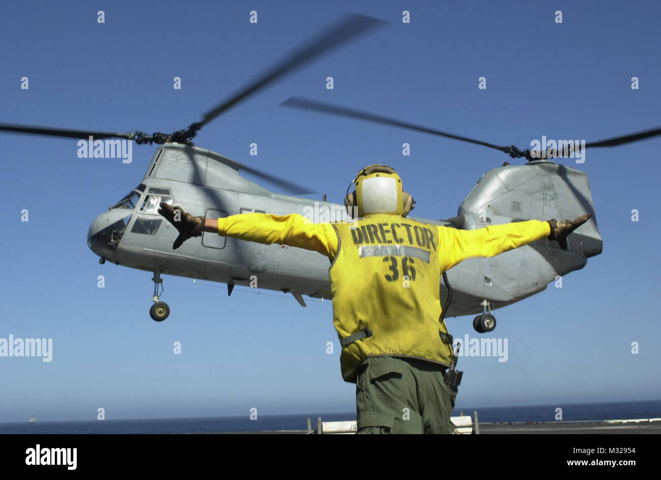 ABH3 Roger Ruiz from Rosemead, California, directs a CH-46 Sea Knight ...