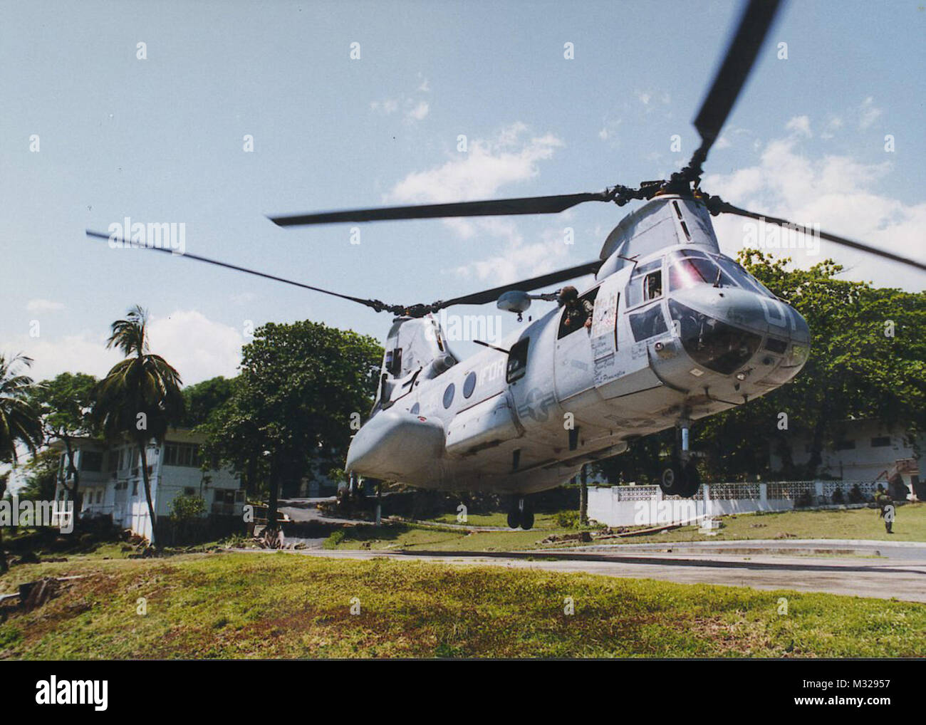 An HMM-162(REIN) CH-46E departs the U.S. Embassy compound in Monrovia ...