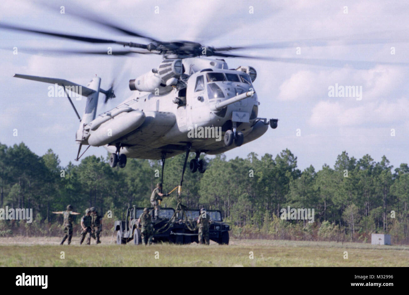 marines from the helicopter support team use a grounding rod to ...