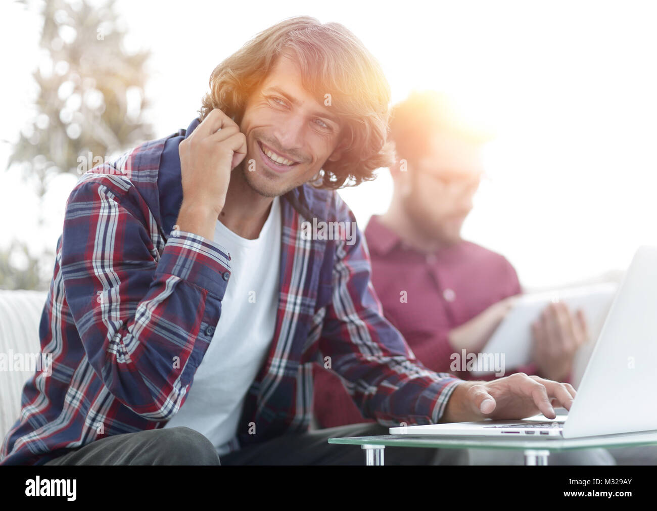 Guy friend sitting desk hi-res stock photography and images - Alamy