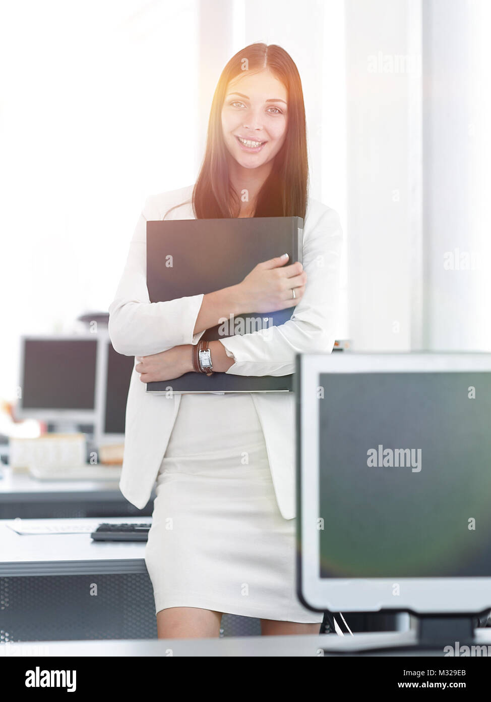 female assistant with documents standing in the office.photo with copy ...