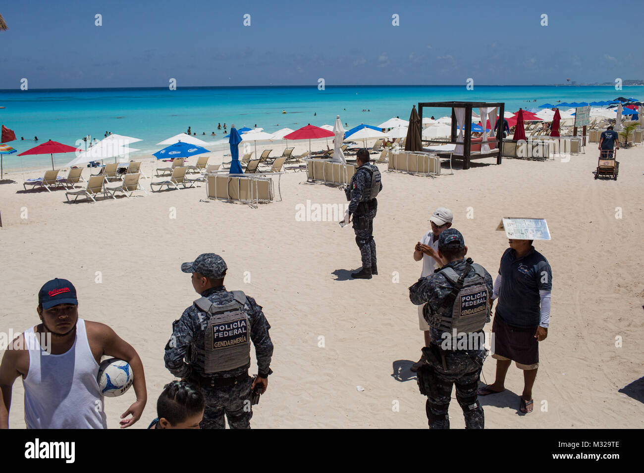 Federal Police officers patrol a beach in Cancun, Mexico, on July 12 ...