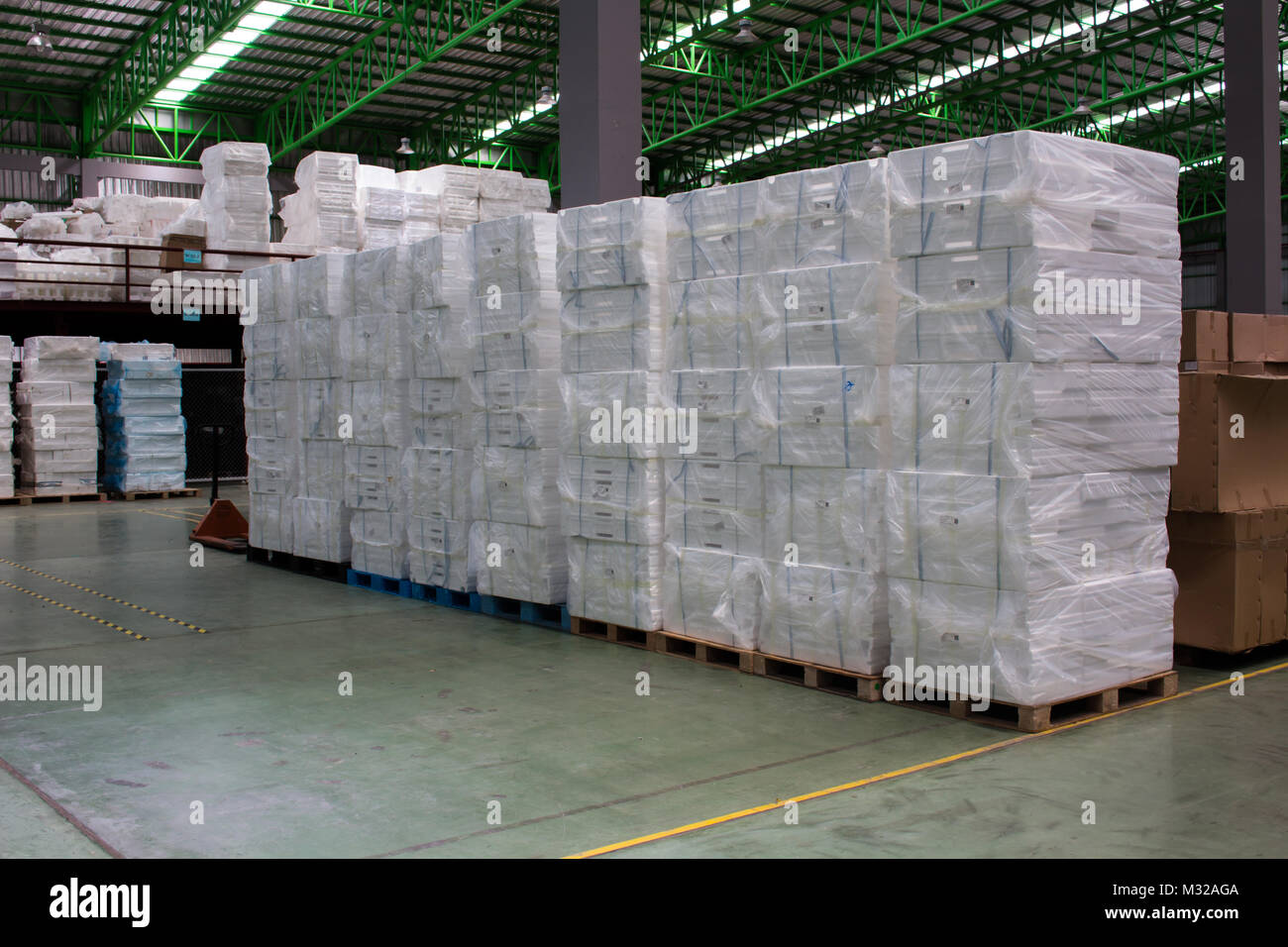 Foam keep of warehouse. Rows of shelves with boxes Stock Photo - Alamy