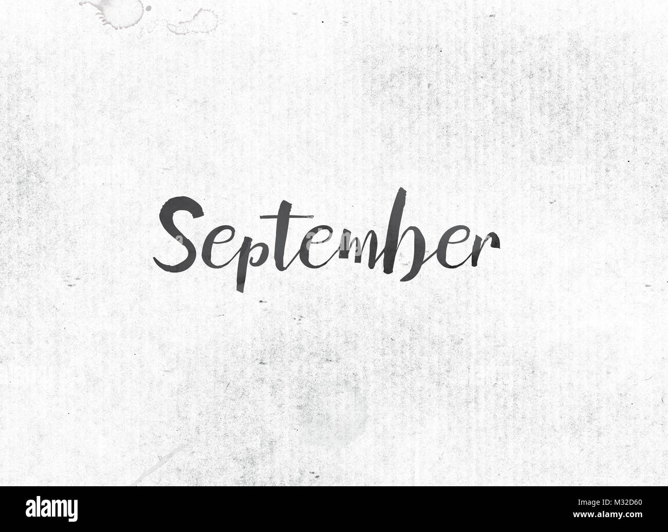 The word September concept and theme painted in black ink on a ...