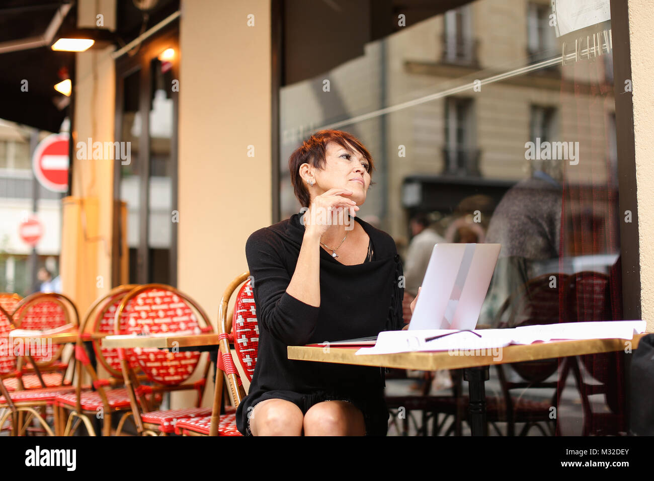 aged female writer working with new book in laptop and have Stock Photo ...