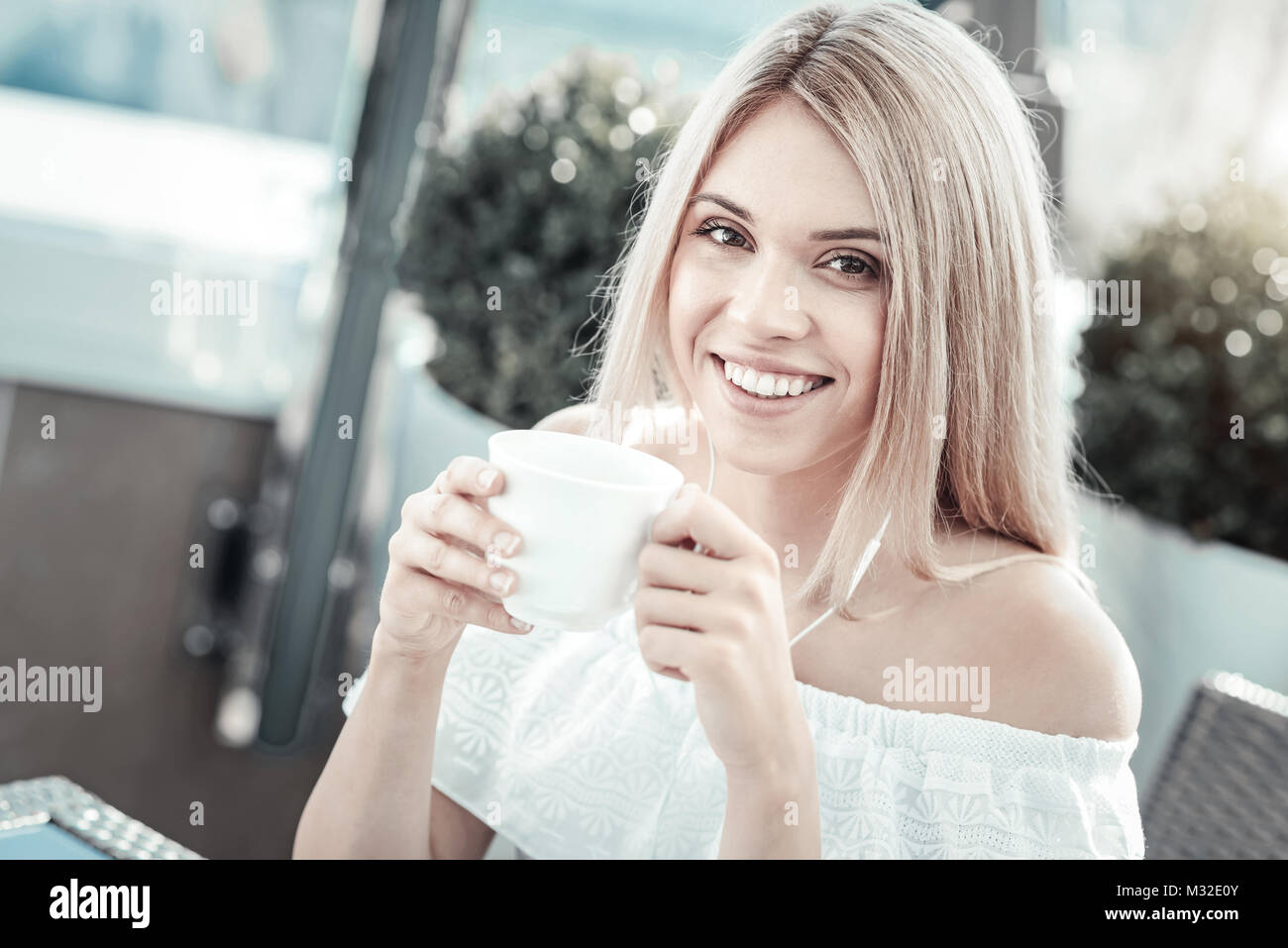 Beautiful happy woman enjoying coffee hi-res stock photography and images - Alamy
