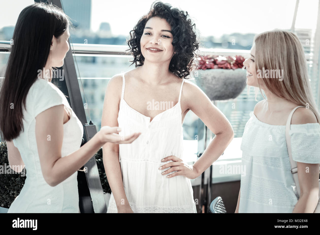 Joyful positive women enjoying their meeting Stock Photo - Alamy