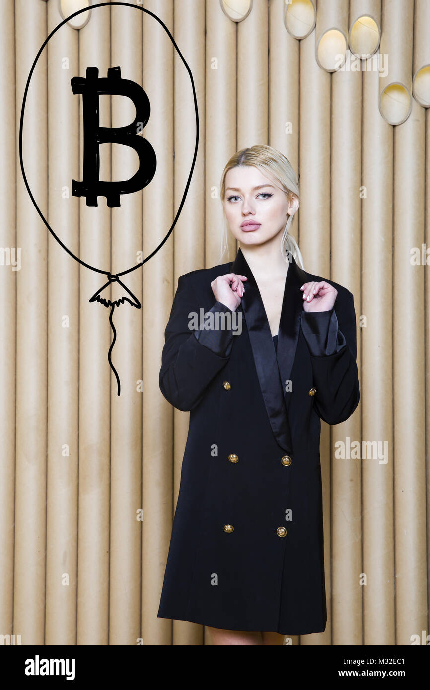 Beautiful blond woman showing standing near bitcoin sketch. Virtual ...