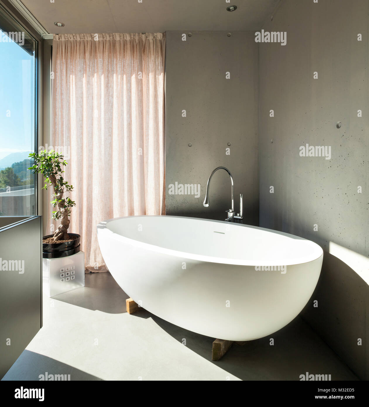 Modern house, detail bathroom, ceramic bathtub Stock Photo - Alamy