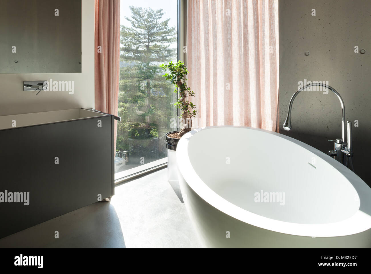 Modern house, detail bathroom, ceramic bathtub Stock Photo - Alamy