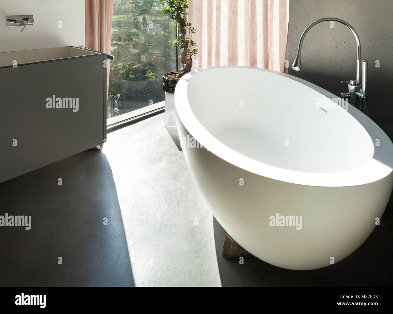 Modern house, detail bathroom, ceramic bathtub Stock Photo - Alamy