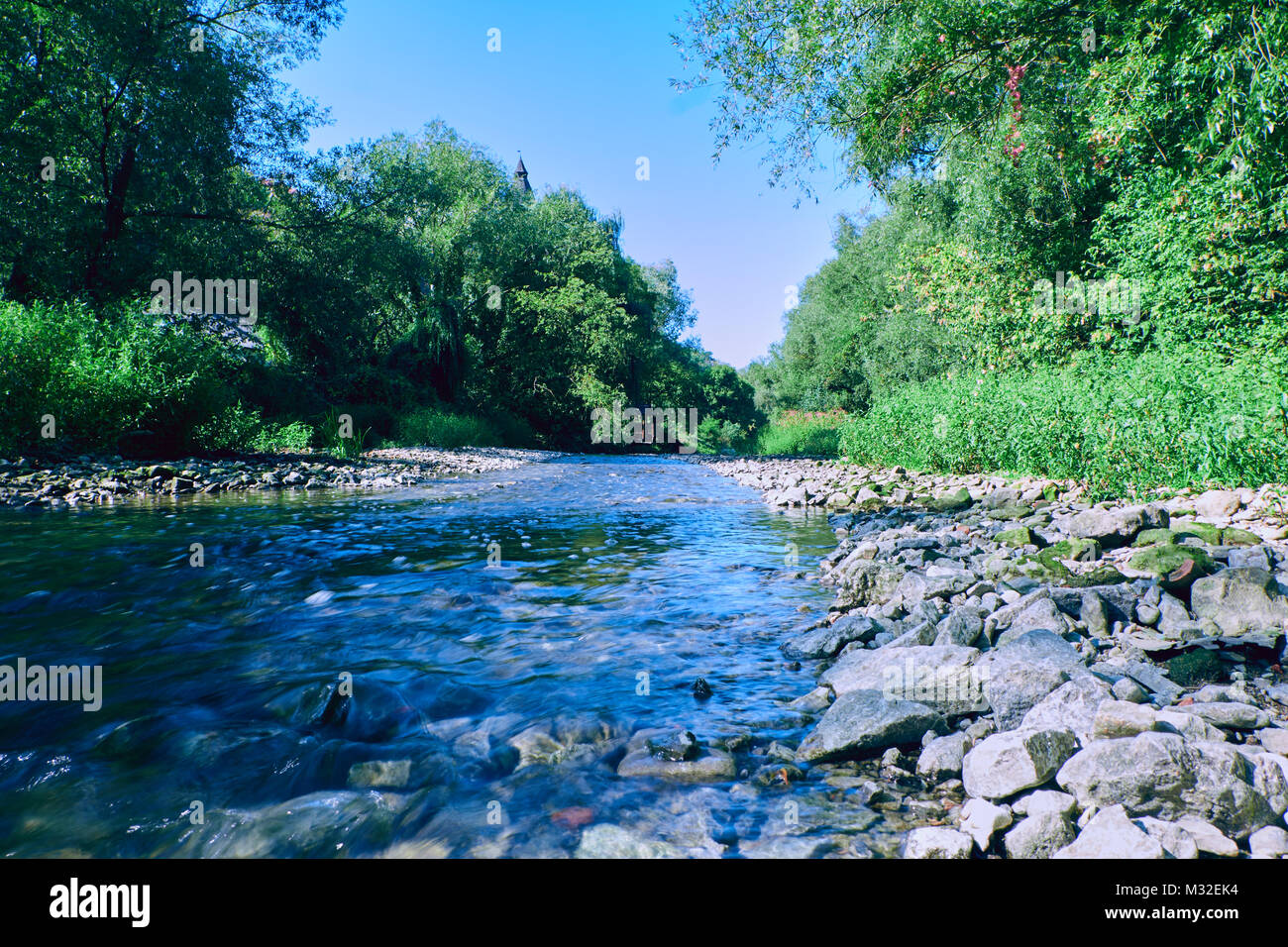 Clear river water. Quick creek stream bank Stock Photo - Alamy