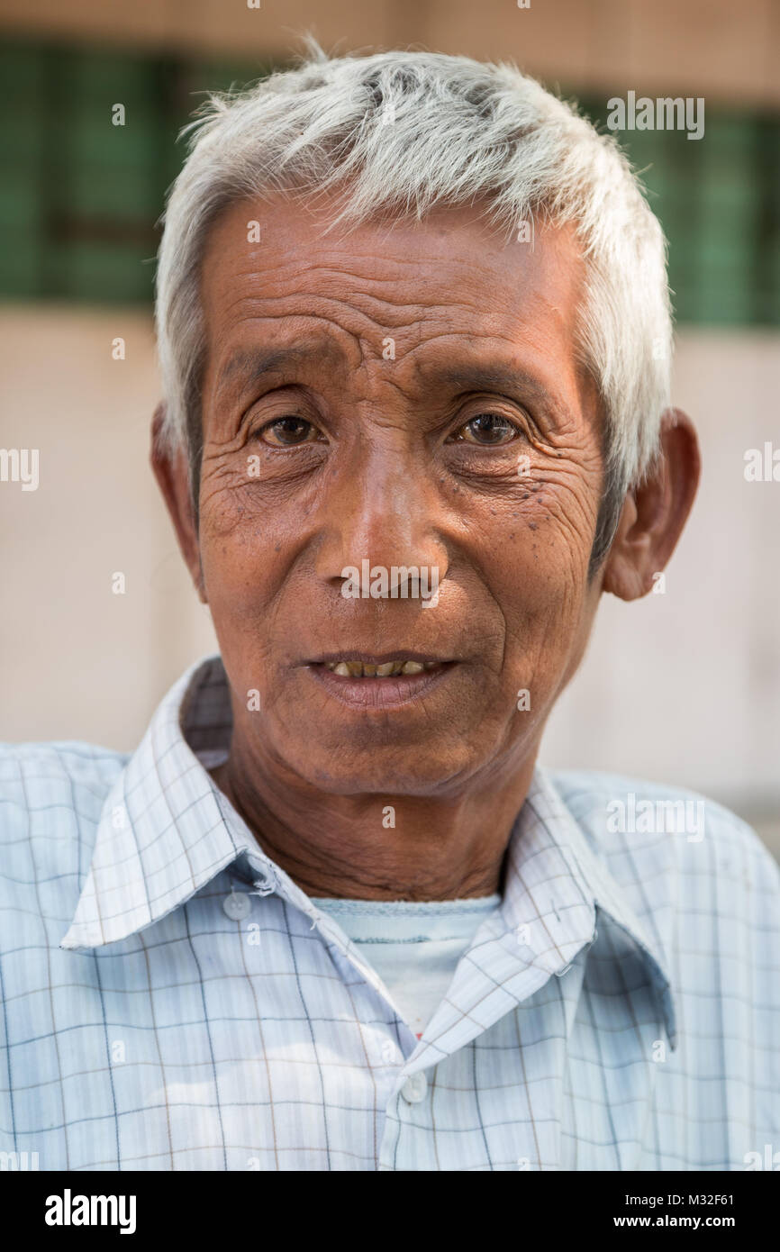 Portrait of an old Myanmarese rickshaw driver man in Mandalay, Myanmar ...