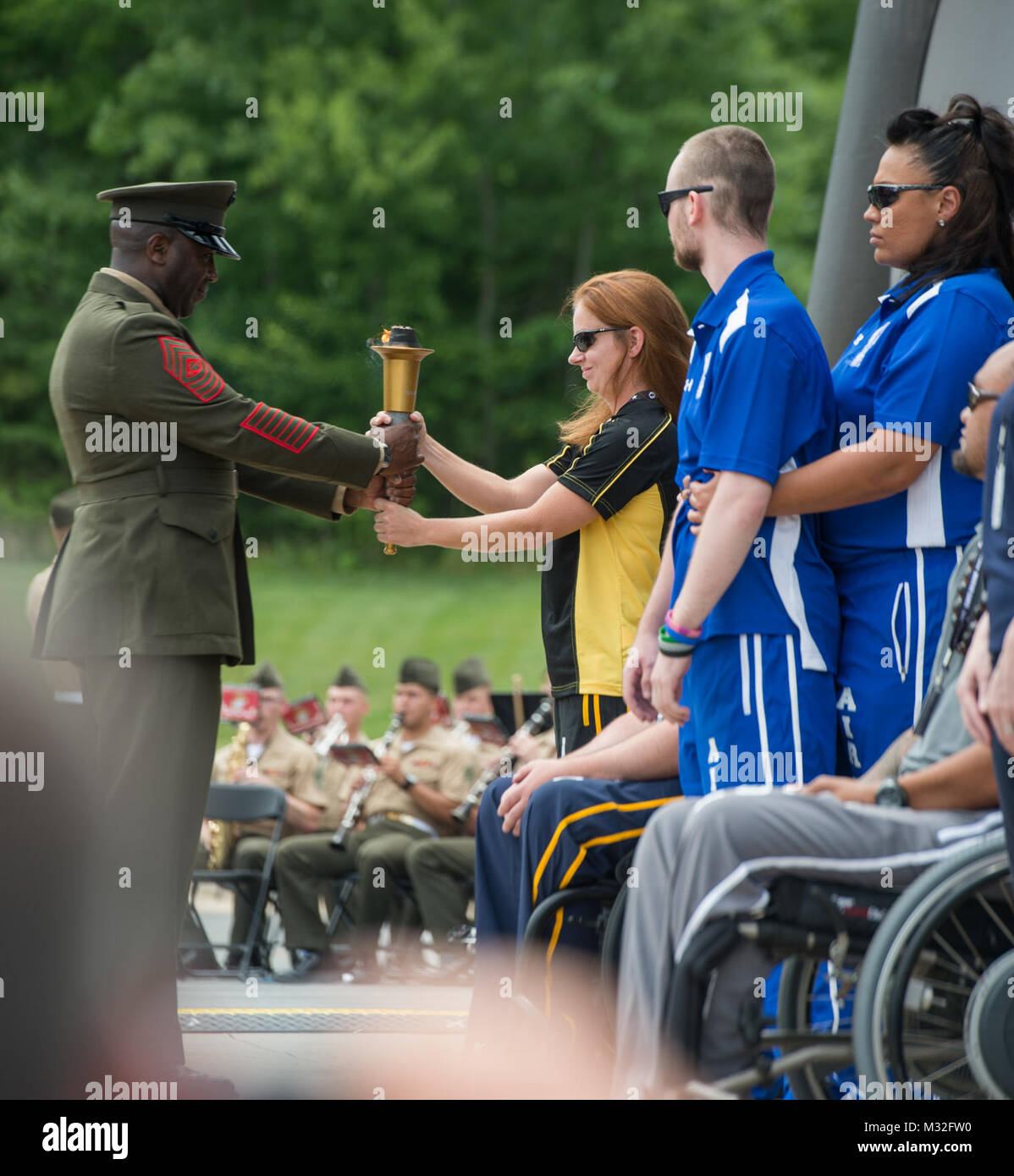 Sgt. Maj. of the Marine Corps Ronald Green passes the torch to a member ...