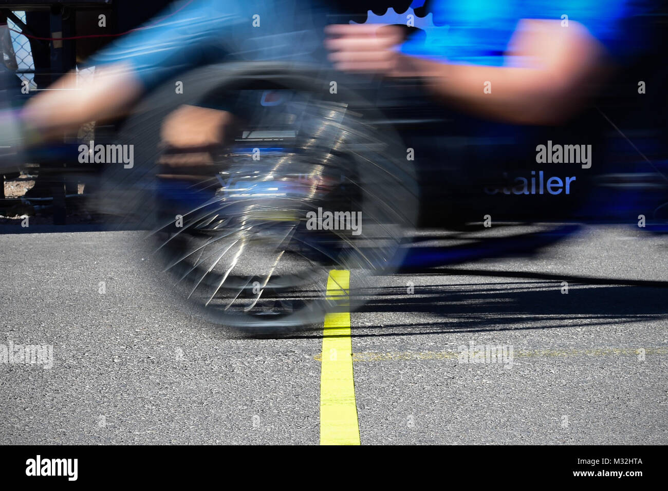 An Air Force Trials cycling competitor rides toward the finish line ...
