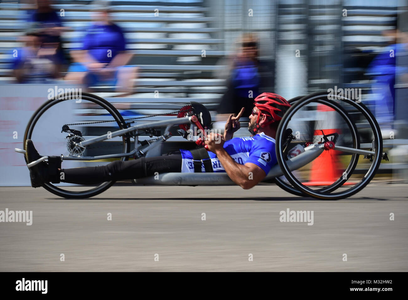 An Air Force Trials cycling competitor rides toward the finish line ...