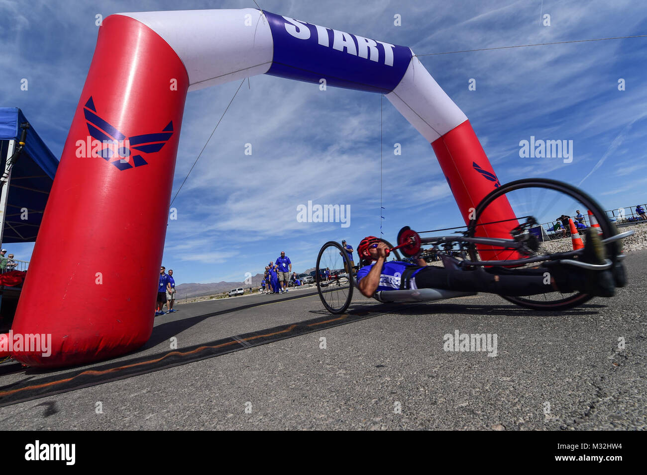 An Air Force Trials cycling competitor rides toward the finish line ...