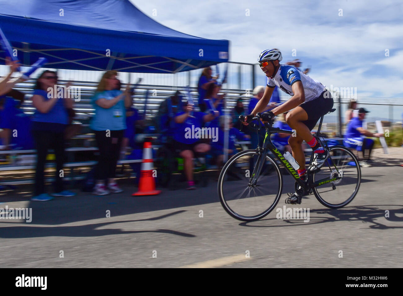 An Air Force Trials cycling competitor rides toward the finish line ...