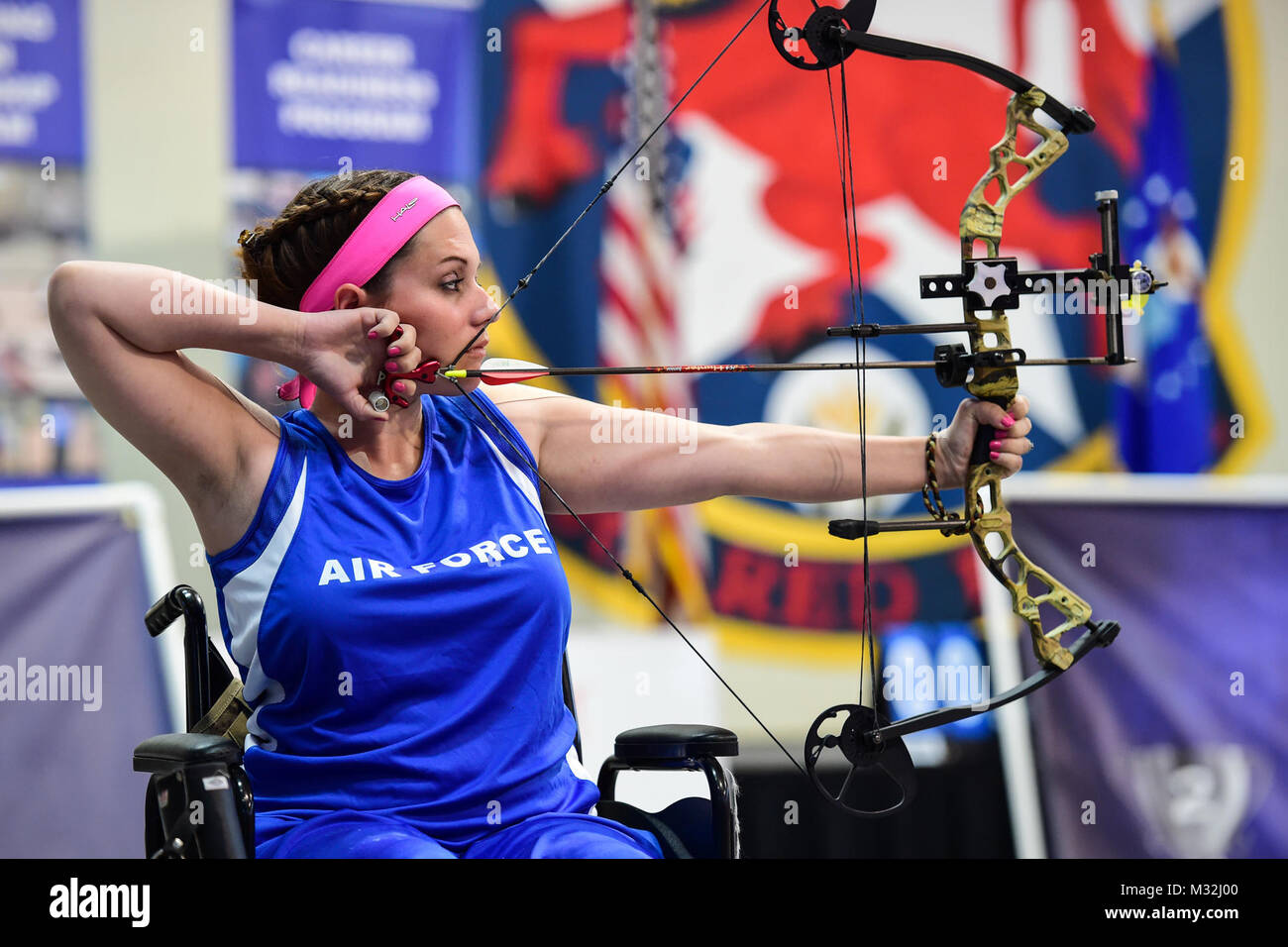 Ashley Crites, Air Force Trials participant, prepares to fire an arrow ...