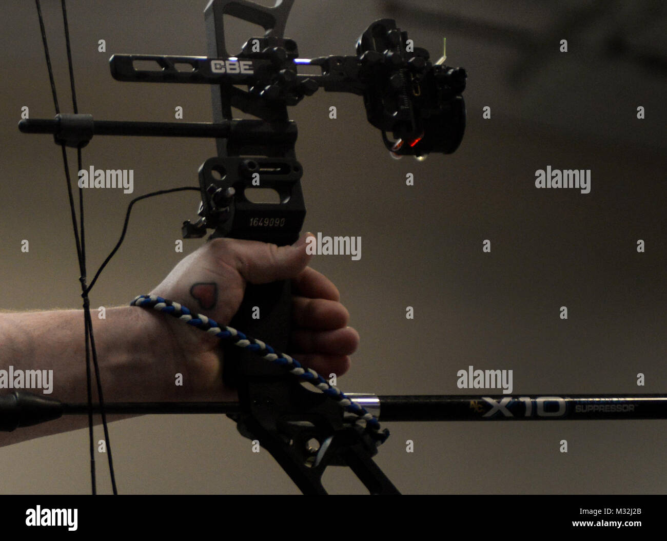 A member of Team USA lines up his shot before firing during the archery ...