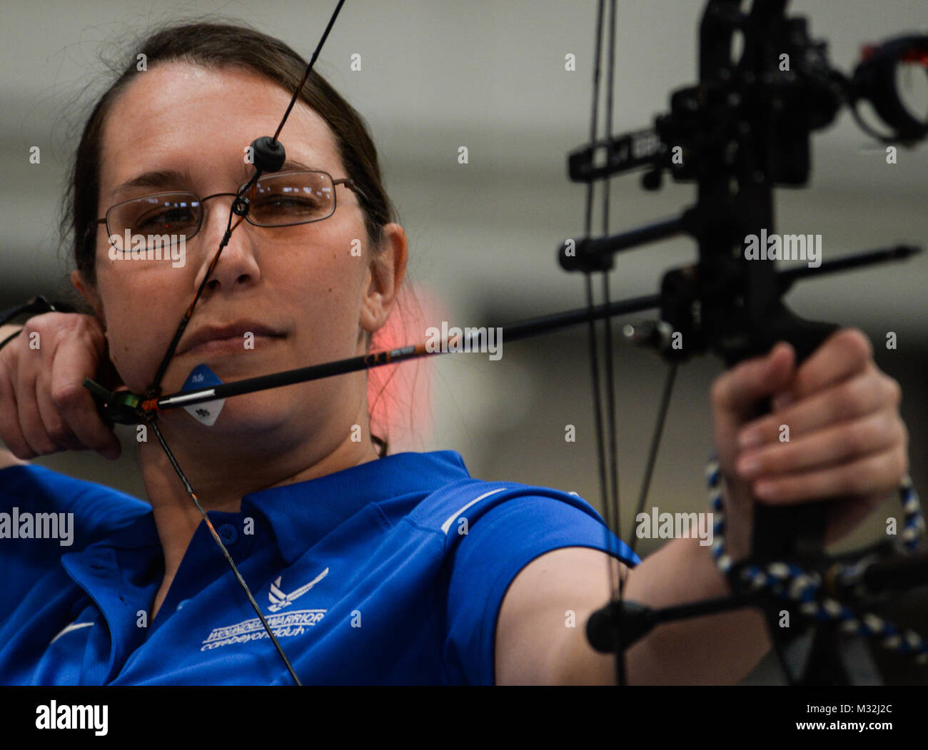 A member of Team USA lines up her shot before firing during the archery ...