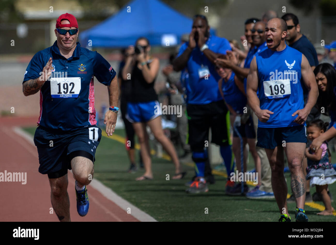 Spectators from the Team USA cheer on Team Australia sprinter competing ...