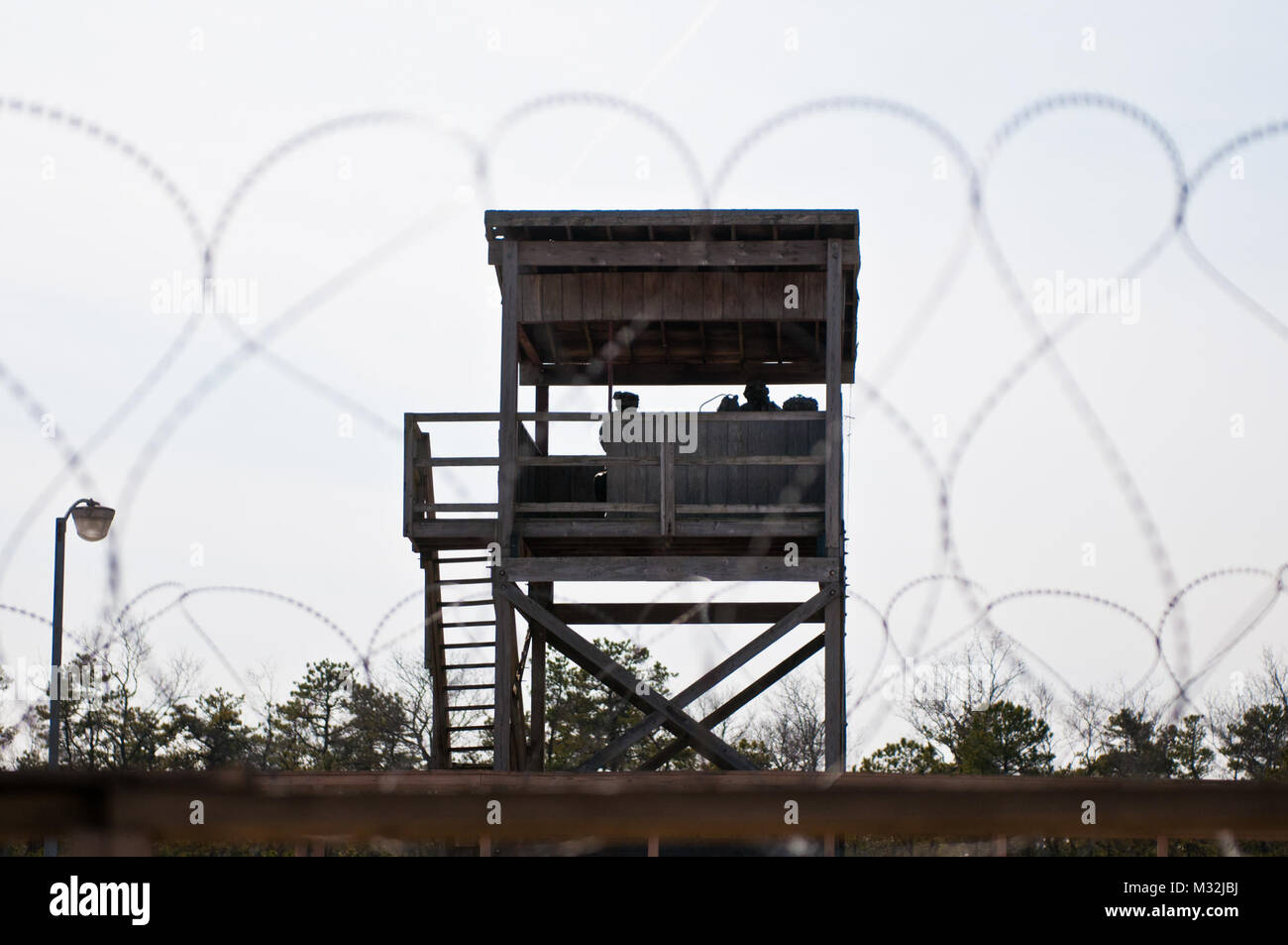Soldiers of the 314th Military Police Company watch over a holding ...