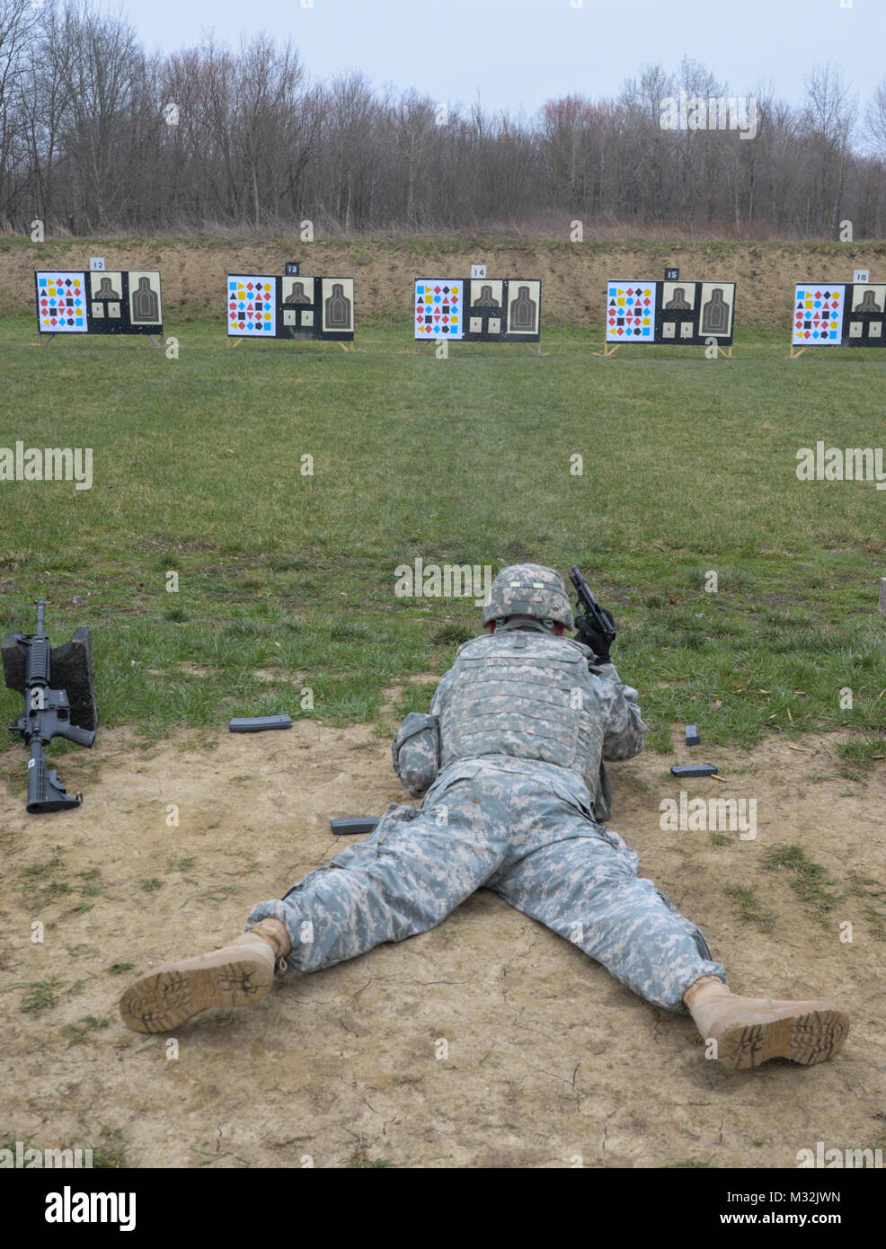 A competitor fires his weapon during the stress shoot event of the 2016 ...