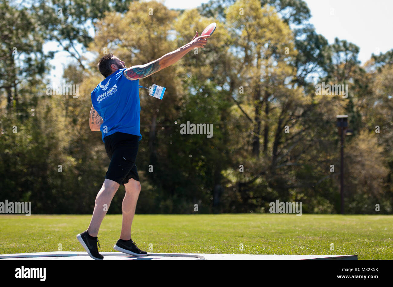 Dustin Goodwin, a Warrior CARE attendee, throws the discus during a ...
