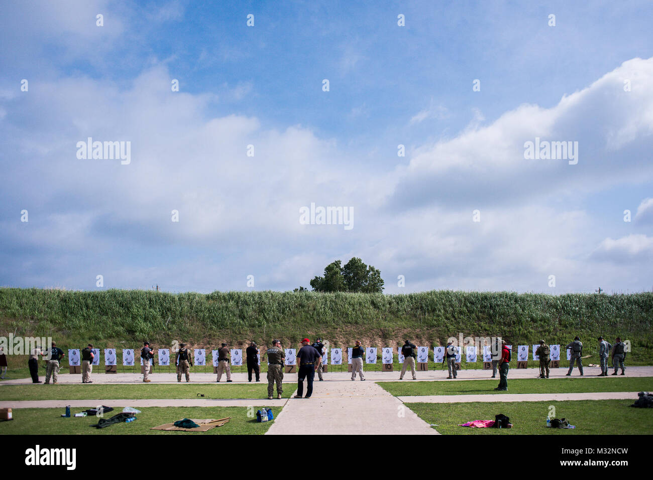 Participants of Patrol Rifle Operator School clear firearms after a ...