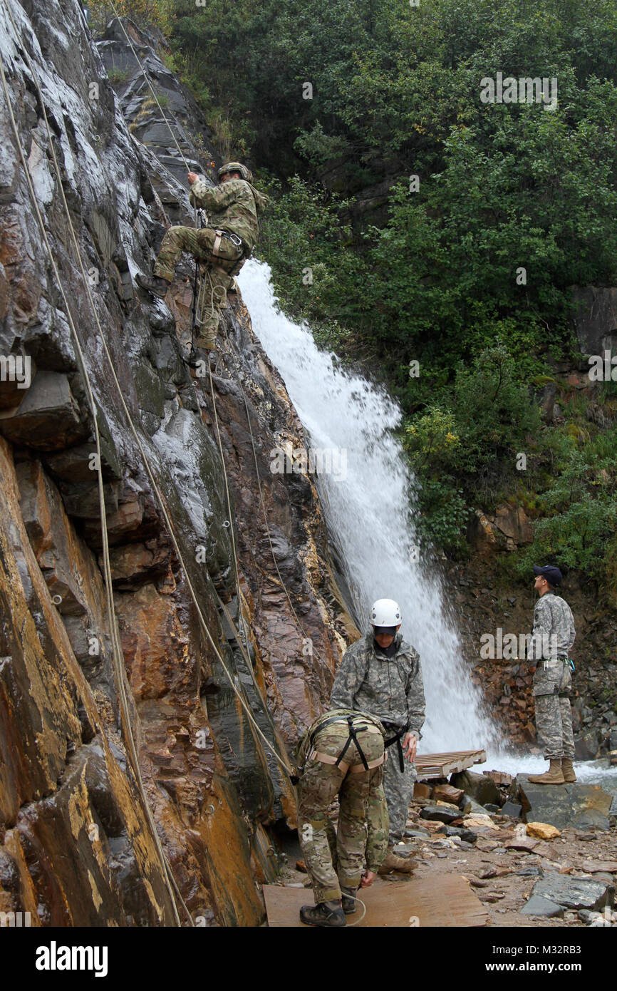 A Ranger fits his foot knot around his boot as he prepares to ascend ...