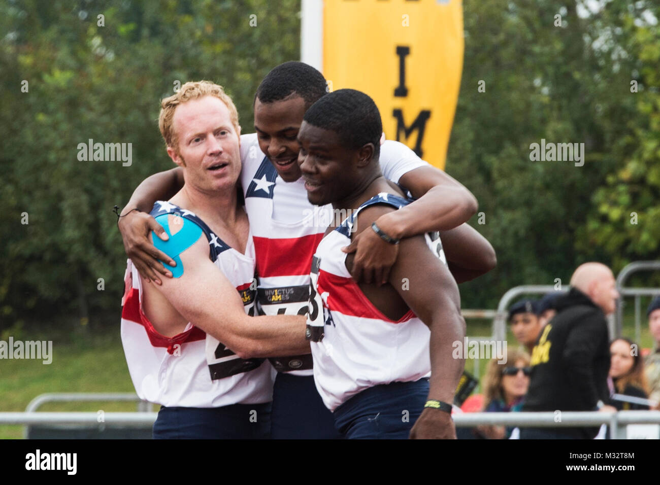 U.S. wounded warrior competitors hug after competing against each other ...