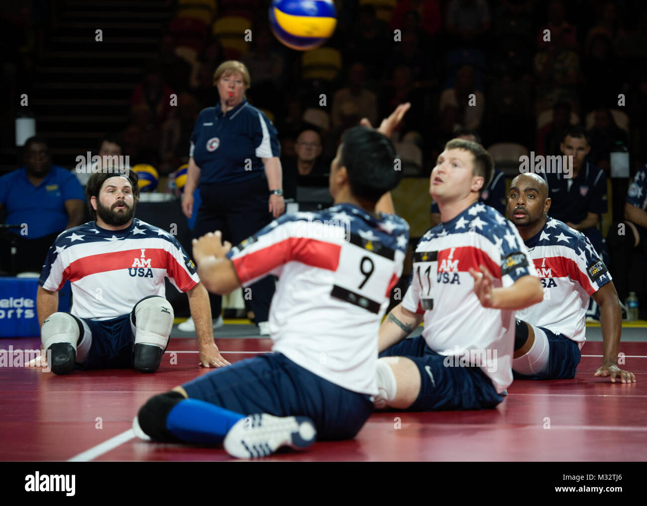 Retired U.S. Army Staff Sgt. Derrick David (center) tracks the ball for ...