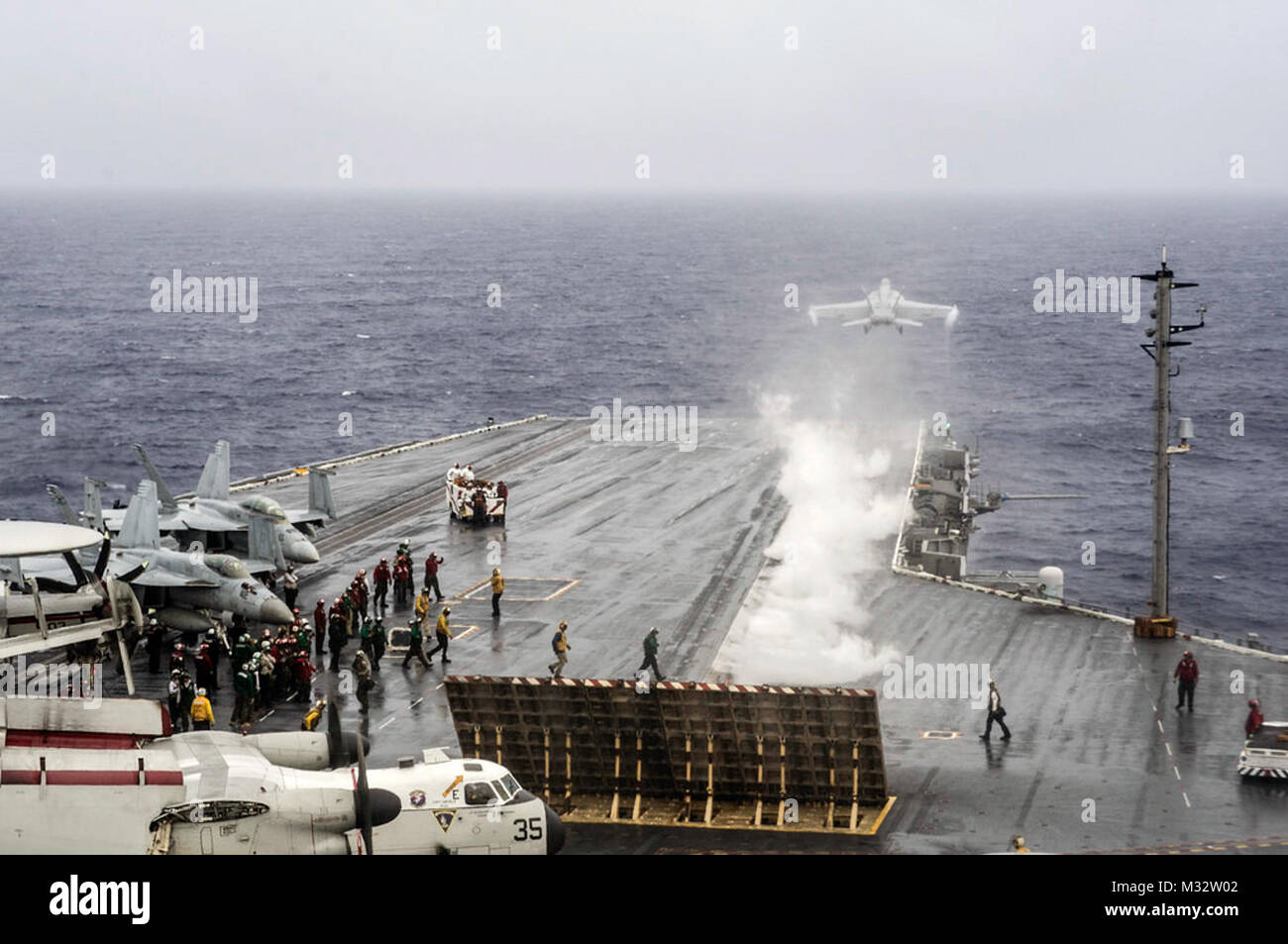 The USS George Washington and its Embarked Air Wing Stand Watch of the ...