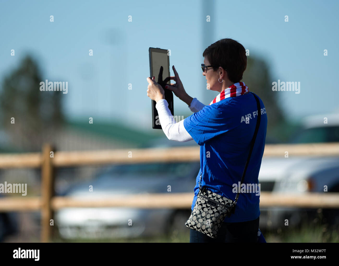 Air Force athlete Ryan Pinney's mom takes a photo during his ...
