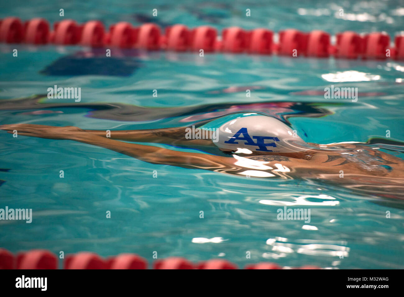 Air Force athlete Jason Hoover swims a warm up lap prior to competition ...