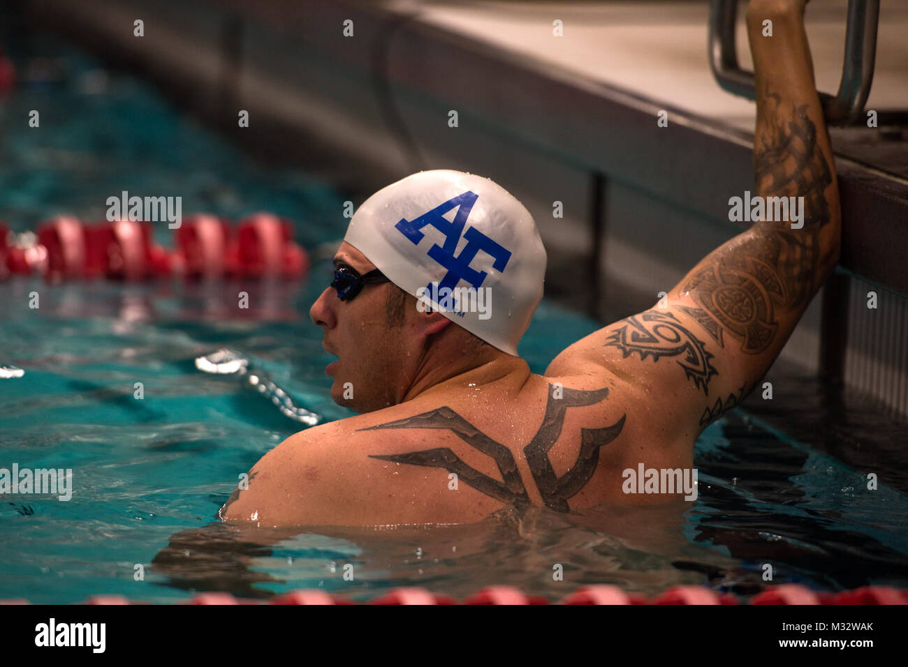 Air Force athlete Jason Hoover looks over the pool after a warm up lap ...