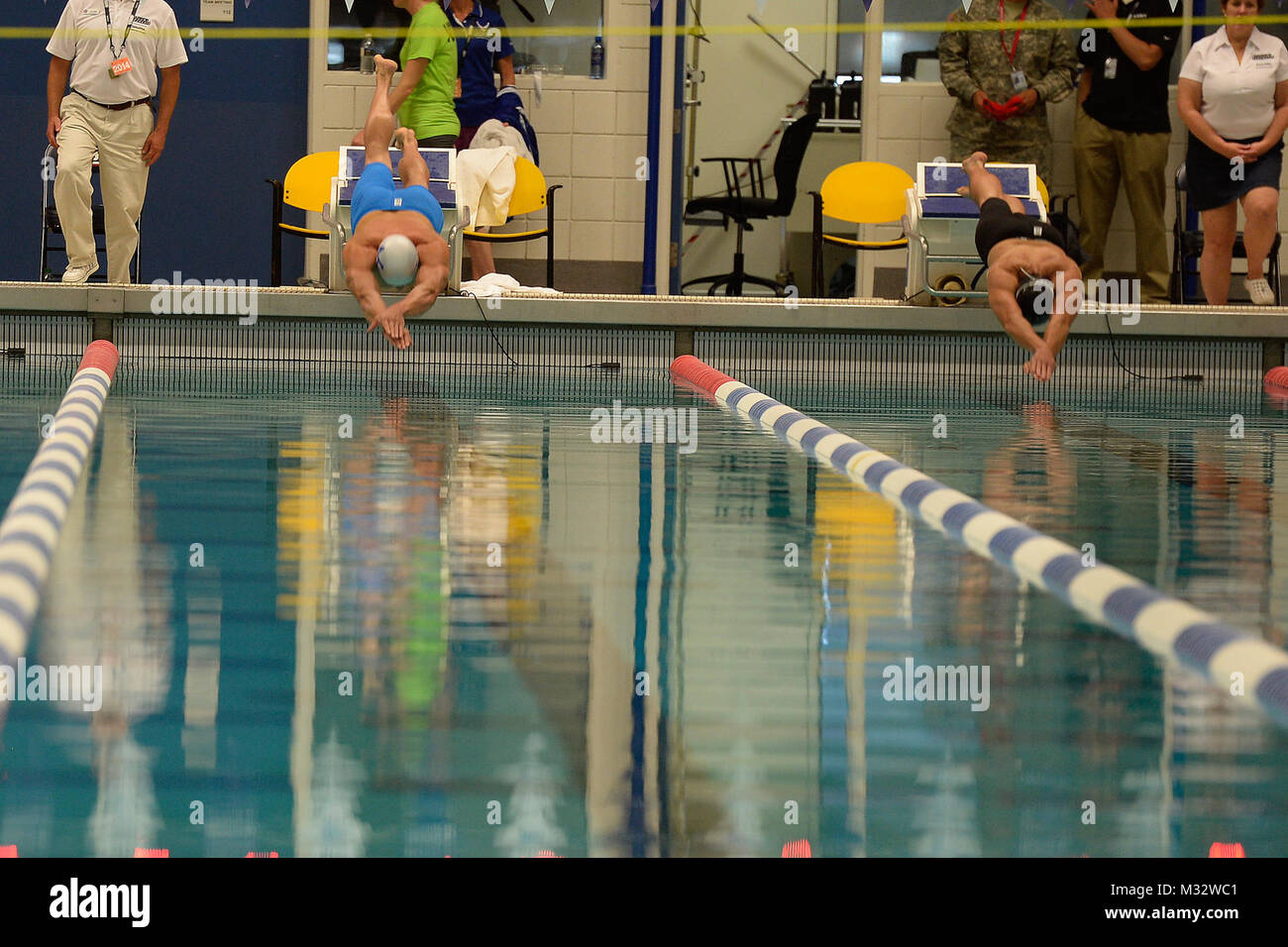 Air Force athlete Timothy Babb(left) enters the water during the 2014 ...