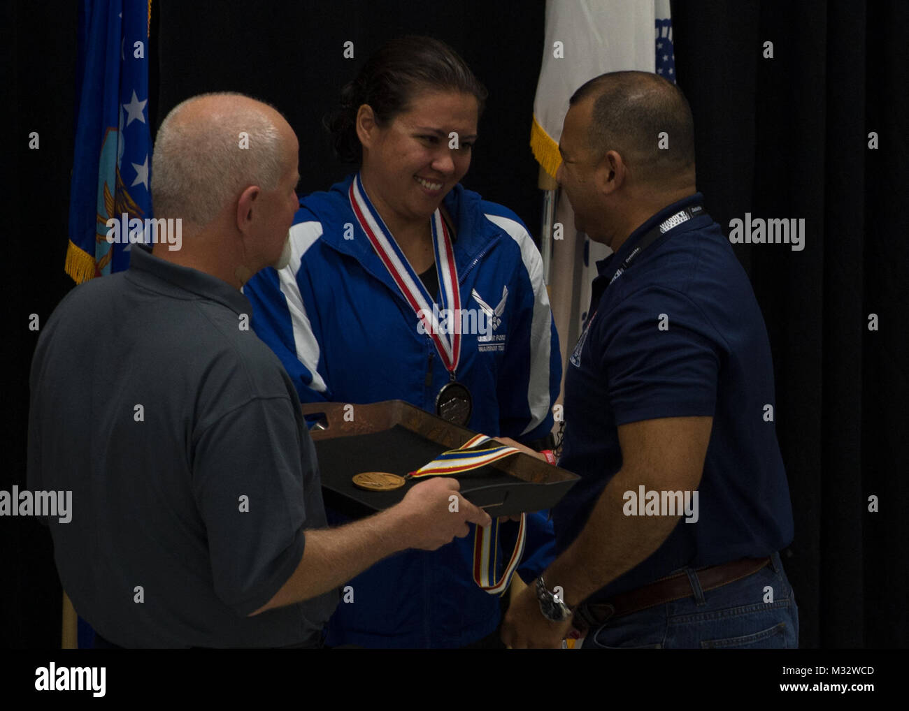 Air Force athlete Sarah Evans receives the silver medal for swimming at ...
