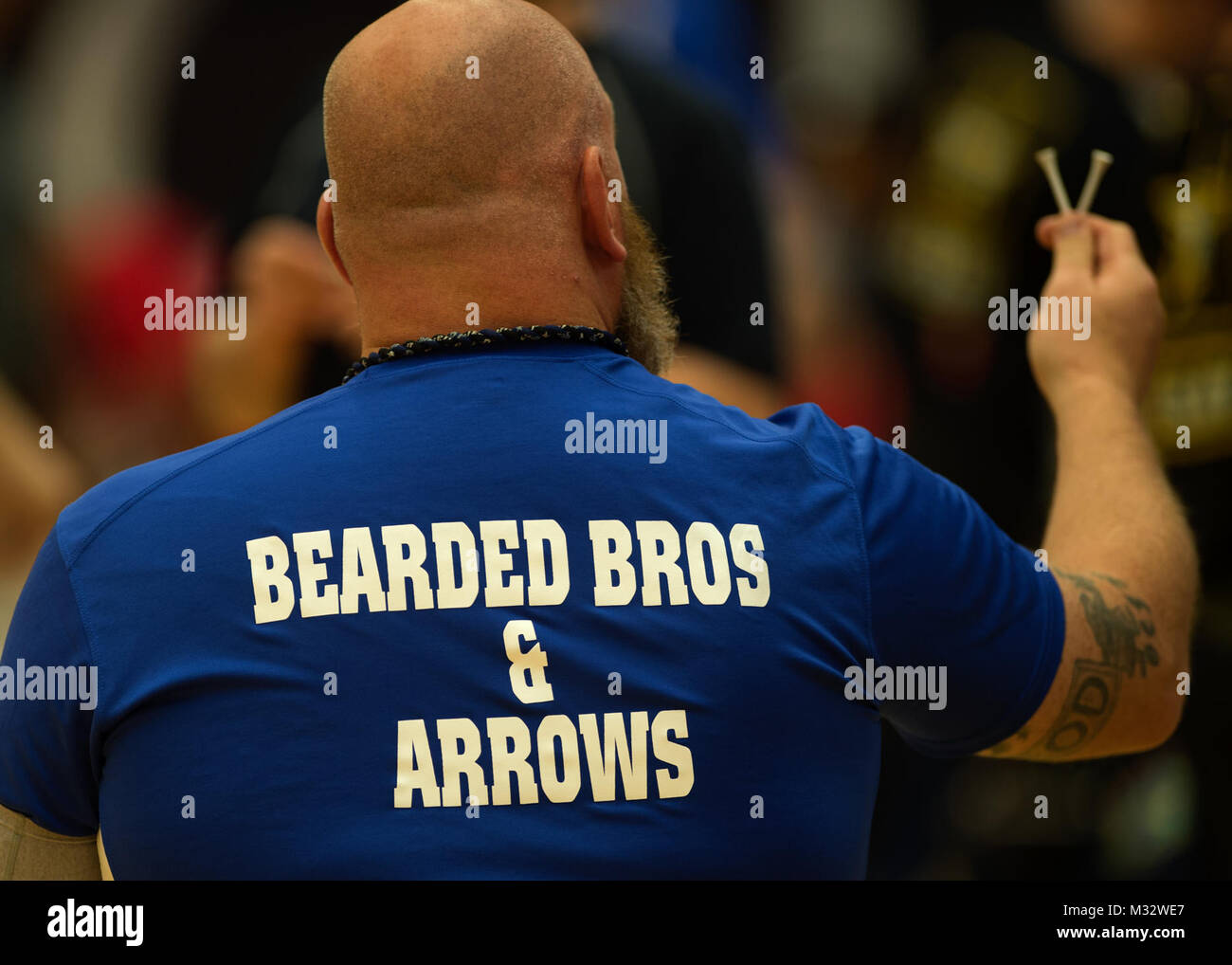 Air Force athlete Keith Sekora holds up bow pieces during the archery ...