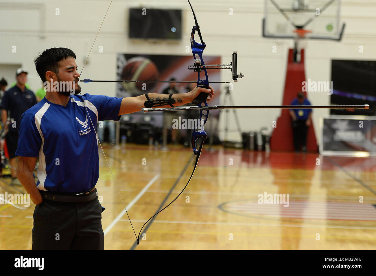 Air Force Athlete Daniel Crane competes in archery during the 2014 ...