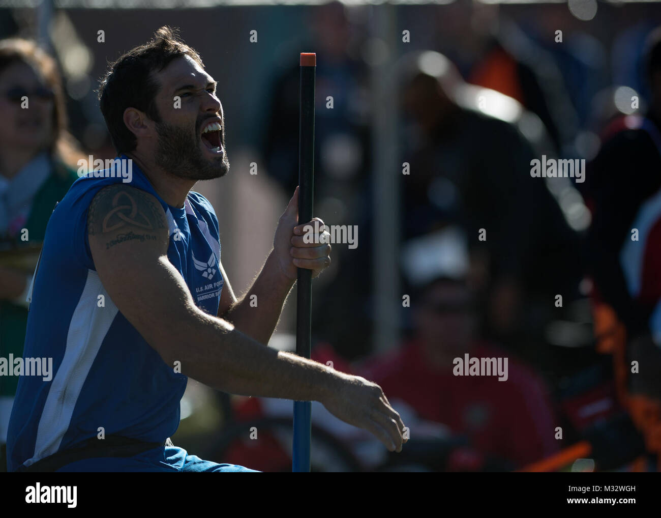 Air Force athlete Ryan Pinney yells after throwing a discus during the ...