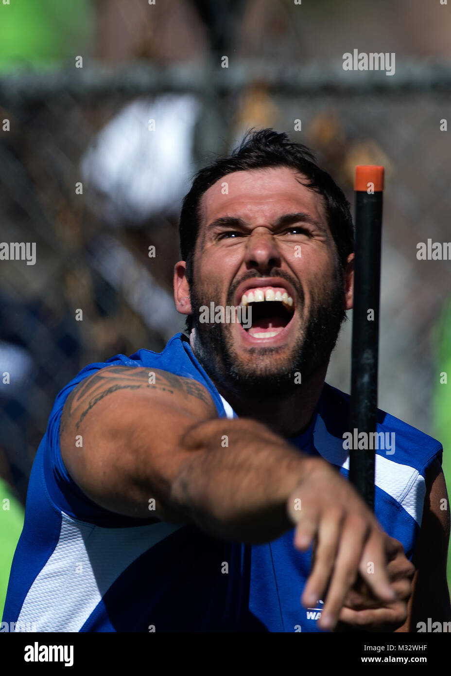 Air Force athlete Ryan Pinney yells after throwing his shot put during ...